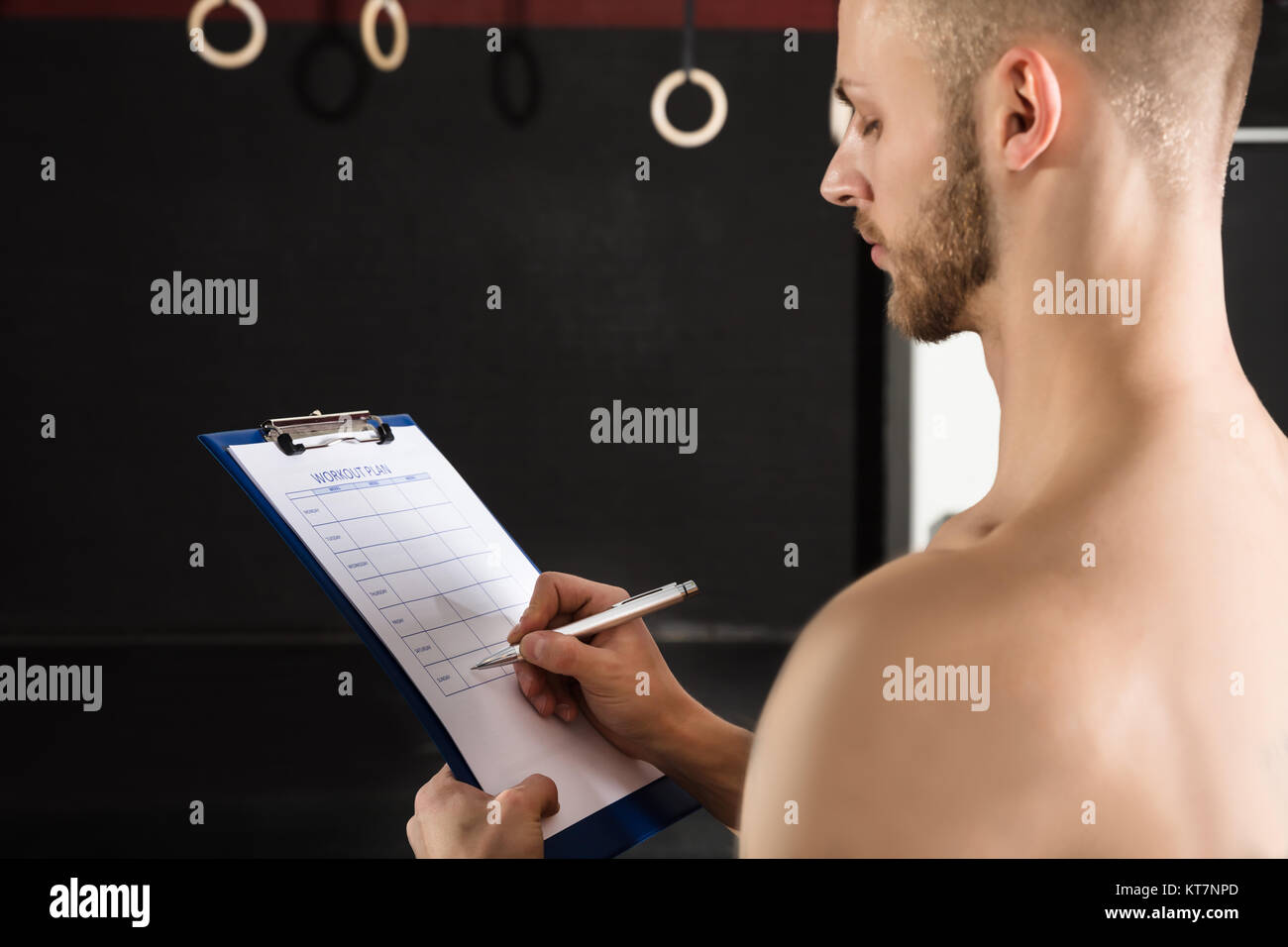Close-up Of A Person Hand Writing A Workout Plan Stock Photo - Alamy