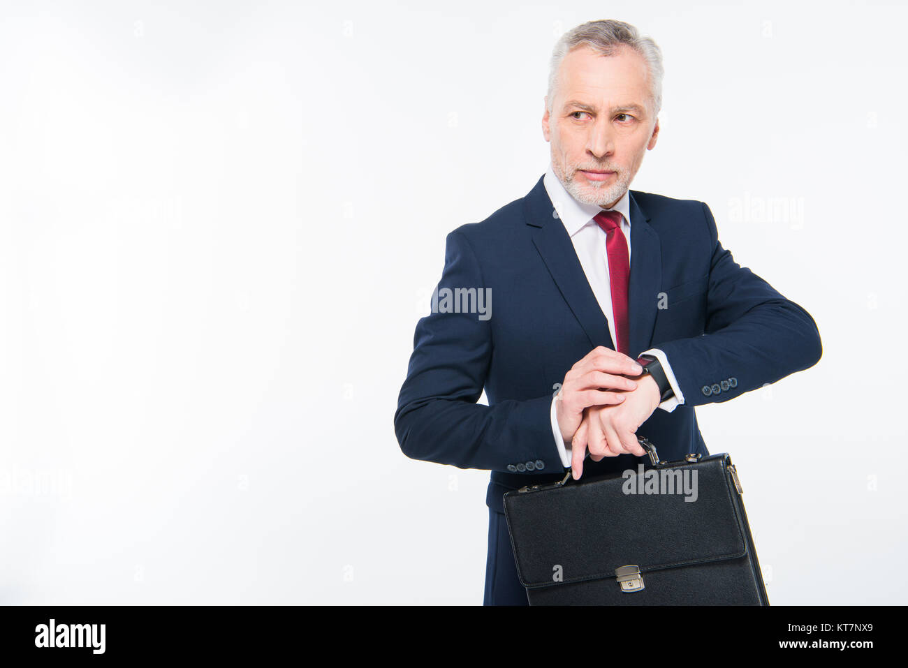 Businessman checking smartwatch Stock Photo - Alamy