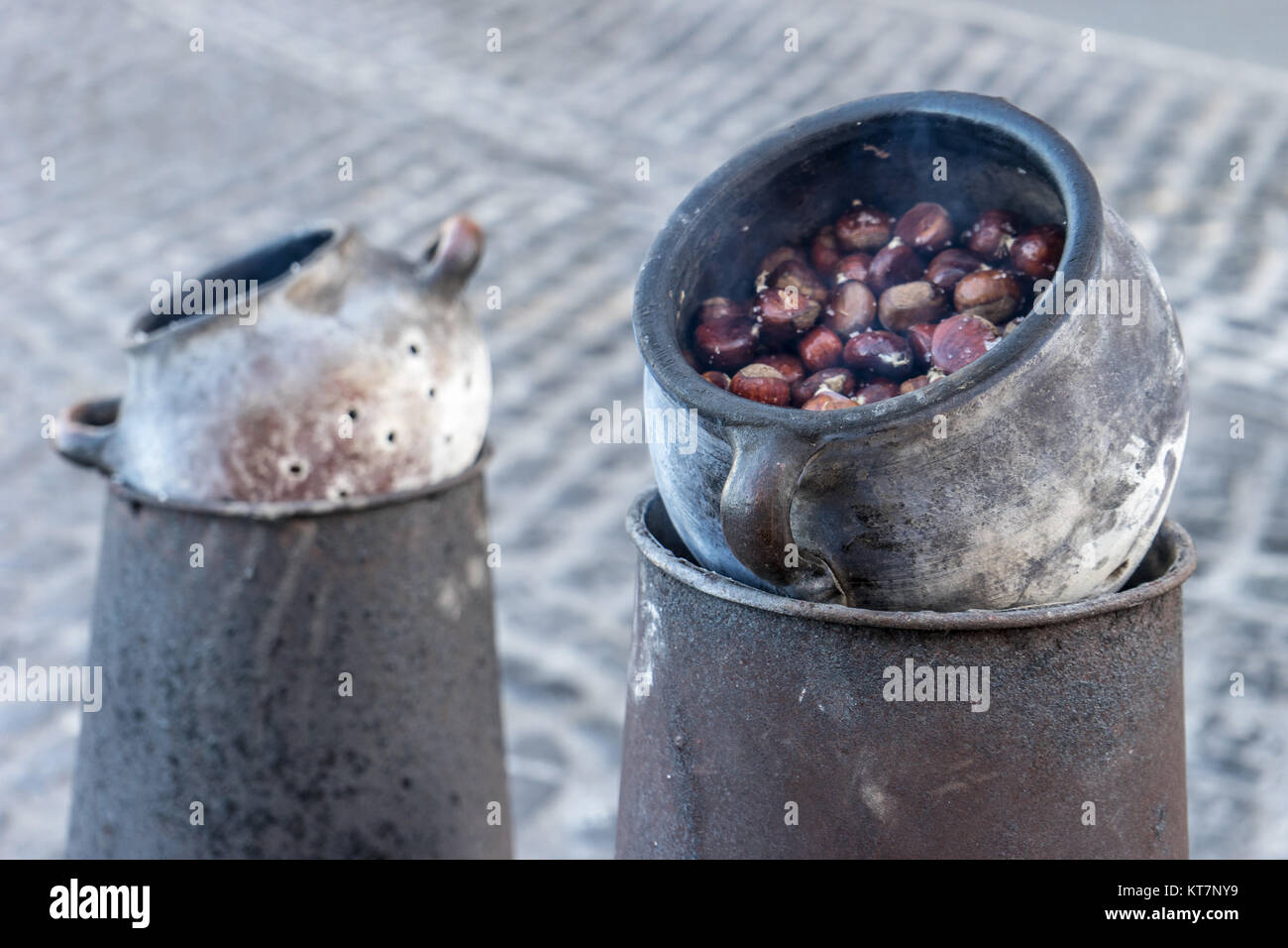 Chestnuts are roasted in clay pots Stock Photo - Alamy