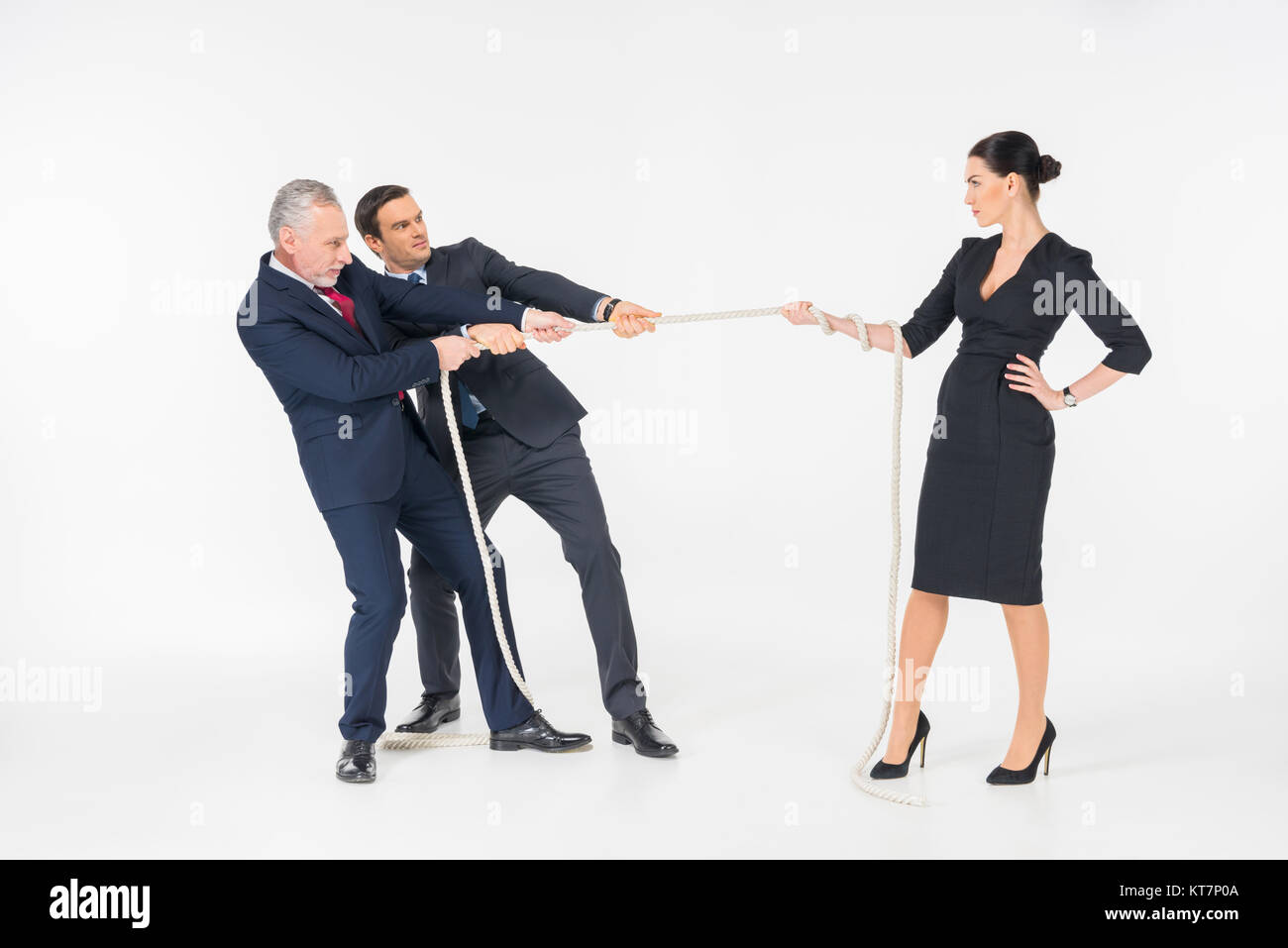 Businesspeople pulling rope Stock Photo - Alamy