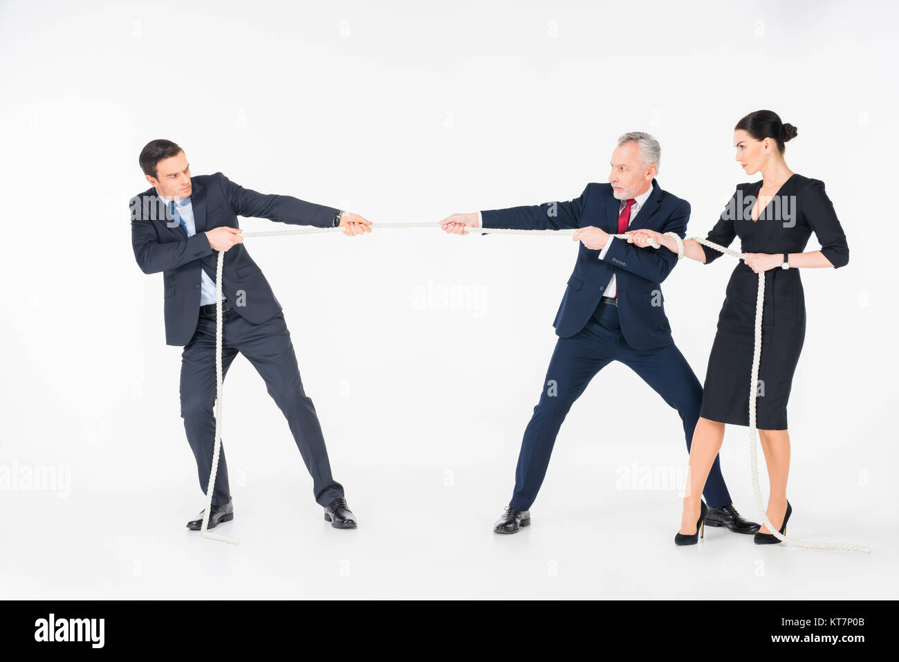 Businesspeople pulling rope Stock Photo - Alamy