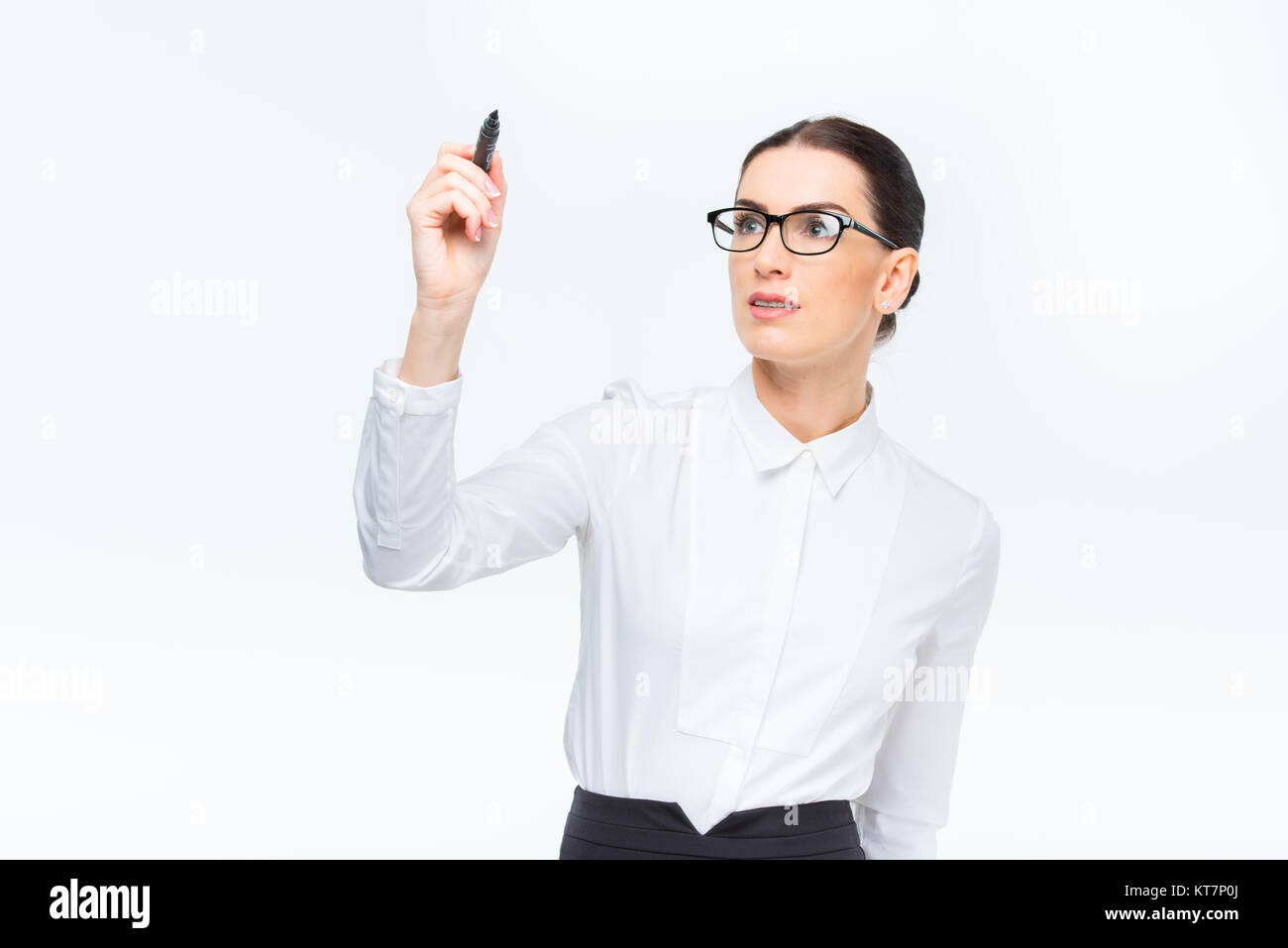 Businesswoman writing with marker Stock Photo - Alamy