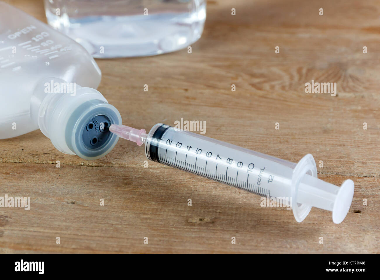saline solution and injection needle Stock Photo - Alamy