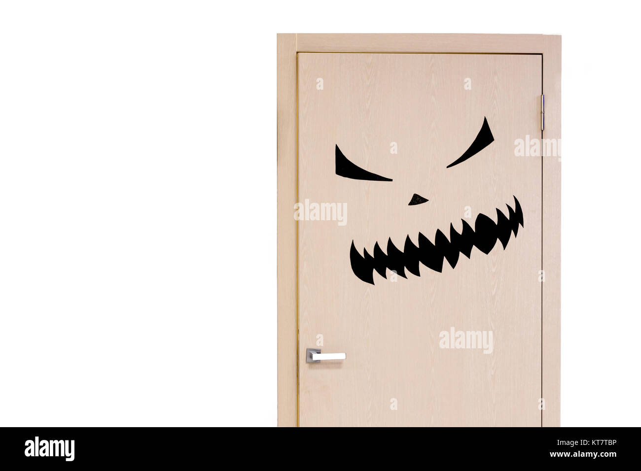 Isolated on white wooden door with black angry scary monster face ...