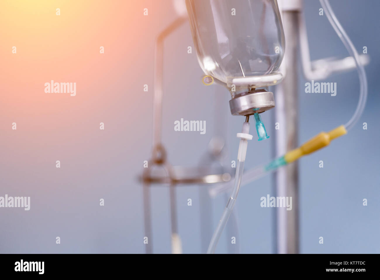 Medical saline iv drip close up on light blue background at hospital ...
