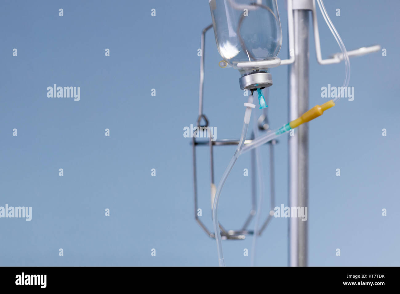 Medical saline iv drip close up on light blue background at hospital ...
