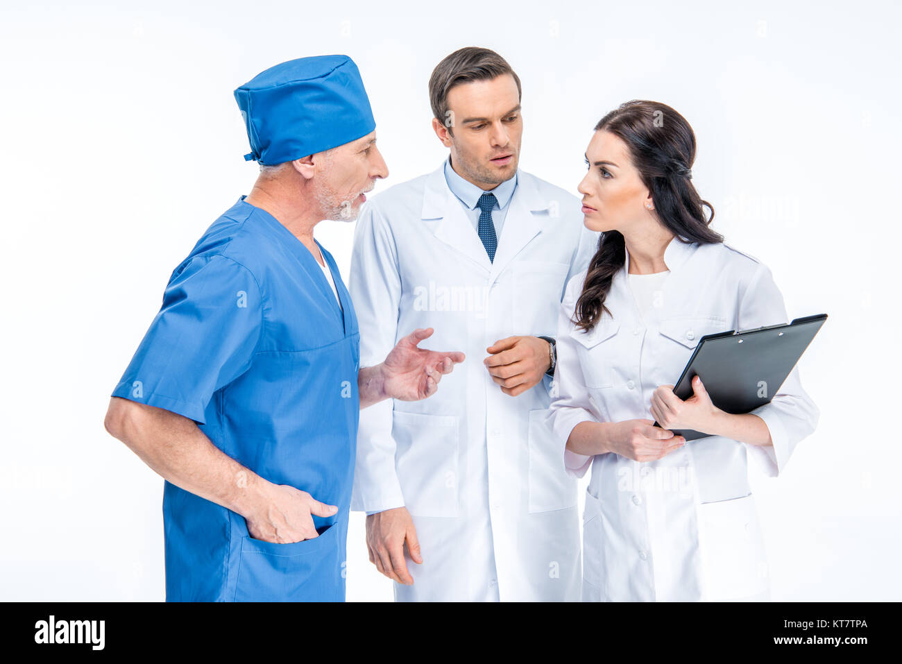 Three doctors chatting Stock Photo - Alamy
