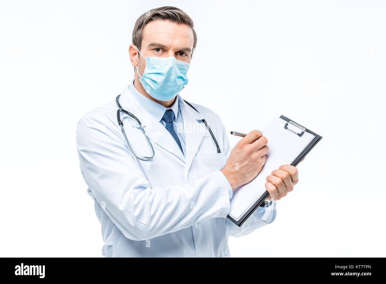 Doctor holding clipboard Stock Photo - Alamy