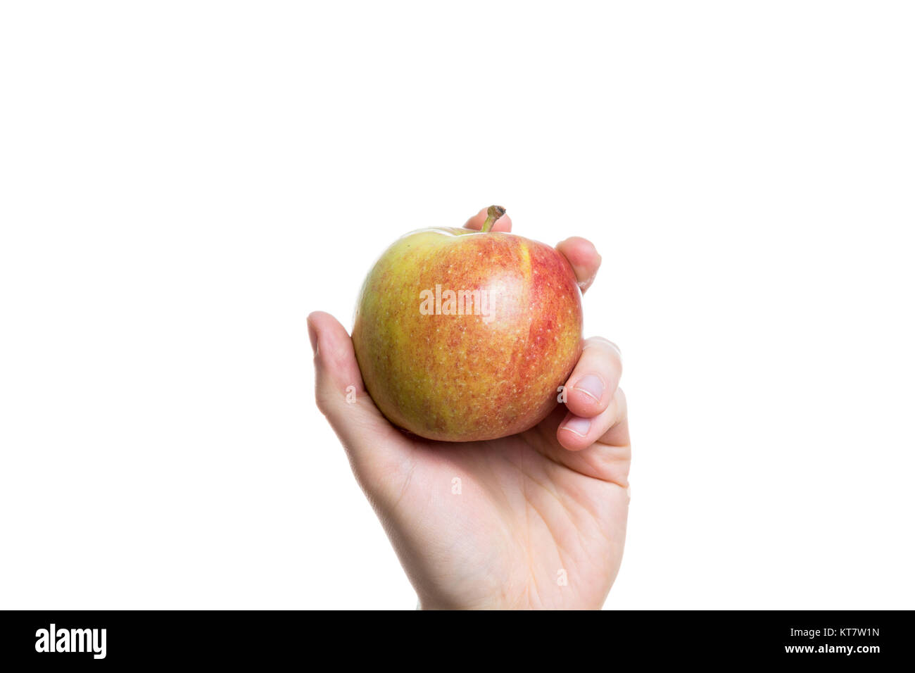 Holding an apple in the hand isolated on white background close up ...