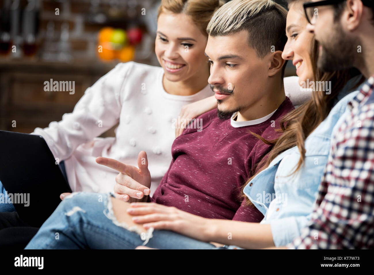 Young friends chatting Stock Photo - Alamy