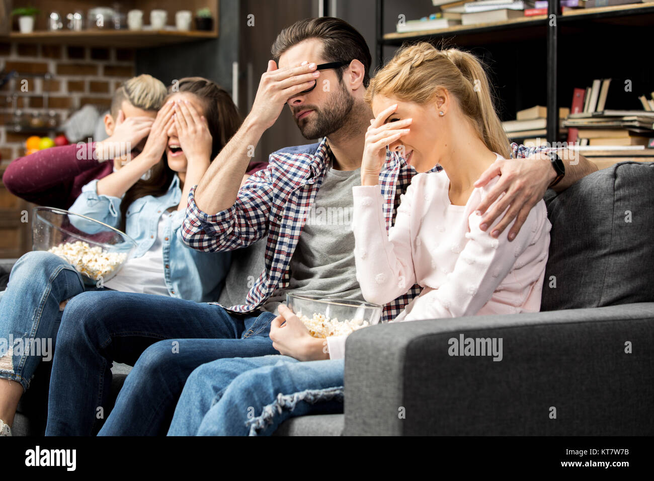 Friends covering their eyes Stock Photo - Alamy