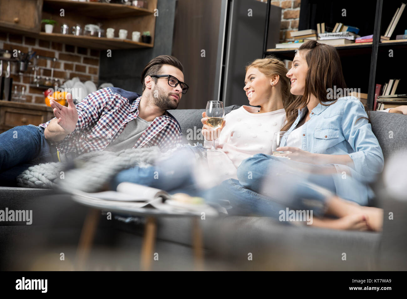 Happy friends chatting Stock Photo - Alamy