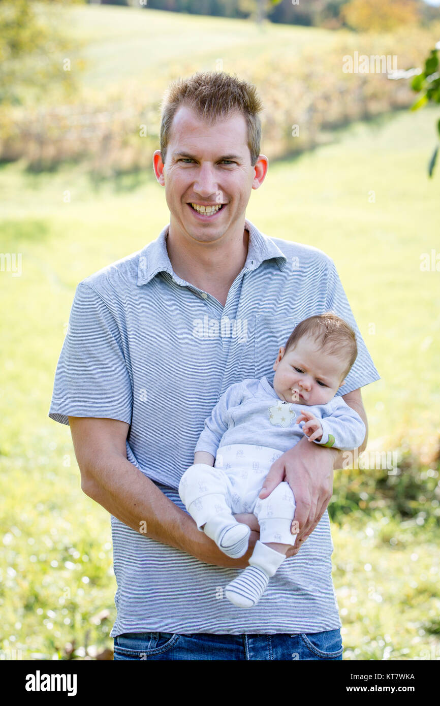 happy young father with newborn baby Stock Photo - Alamy