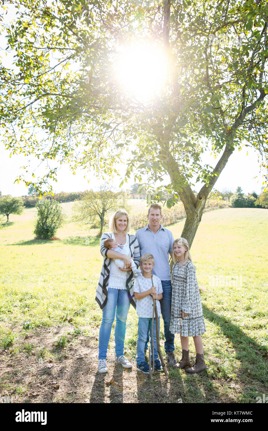 happy young family with 3 children outdoors Stock Photo - Alamy
