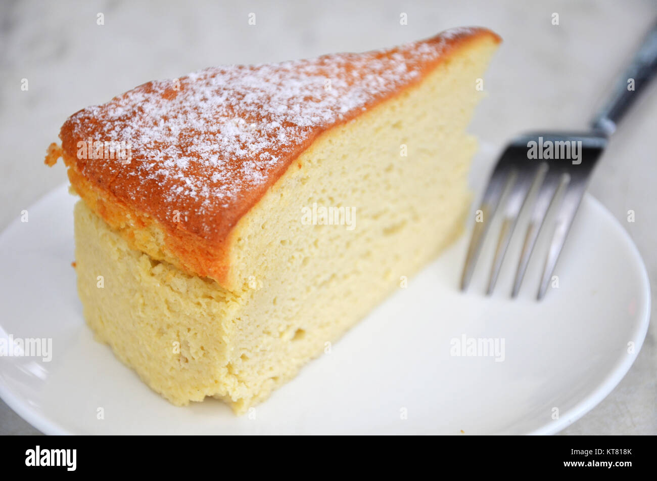 Yellow cheese cake on table Stock Photo - Alamy