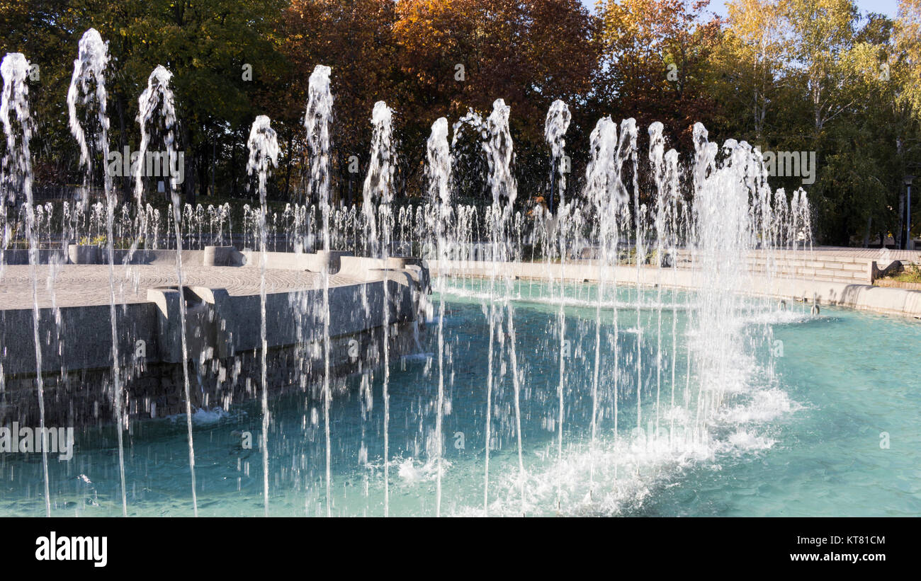 Fountain Splashing Water In The Park Stock Photo - Alamy