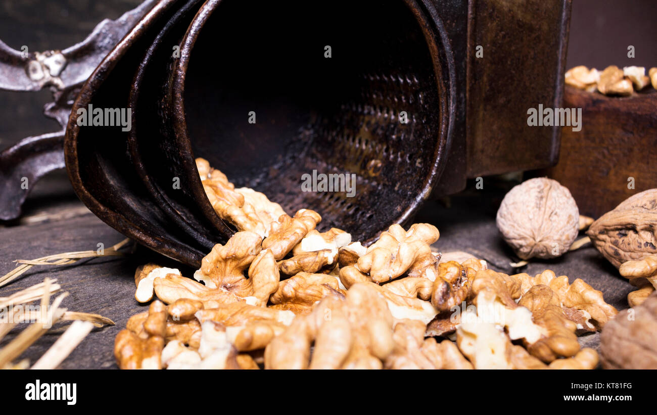 Walnuts and hand walnuts grinder Stock Photo - Alamy