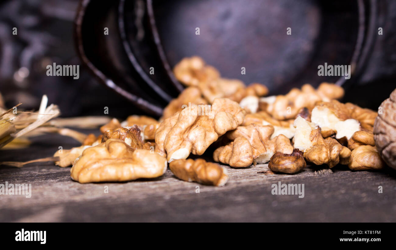 Walnuts and hand walnuts grinder Stock Photo - Alamy