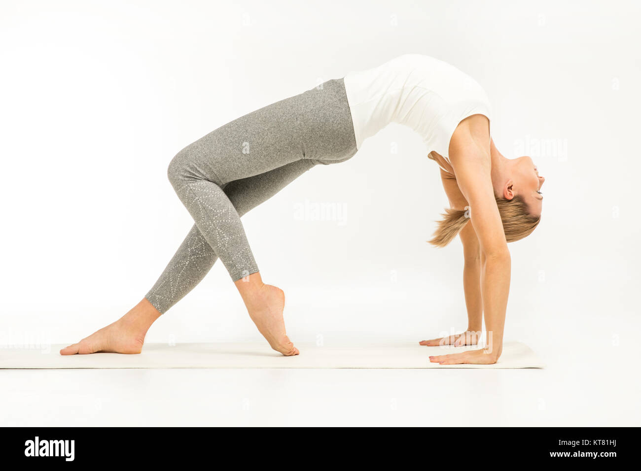 Woman standing in yoga position Stock Photo - Alamy