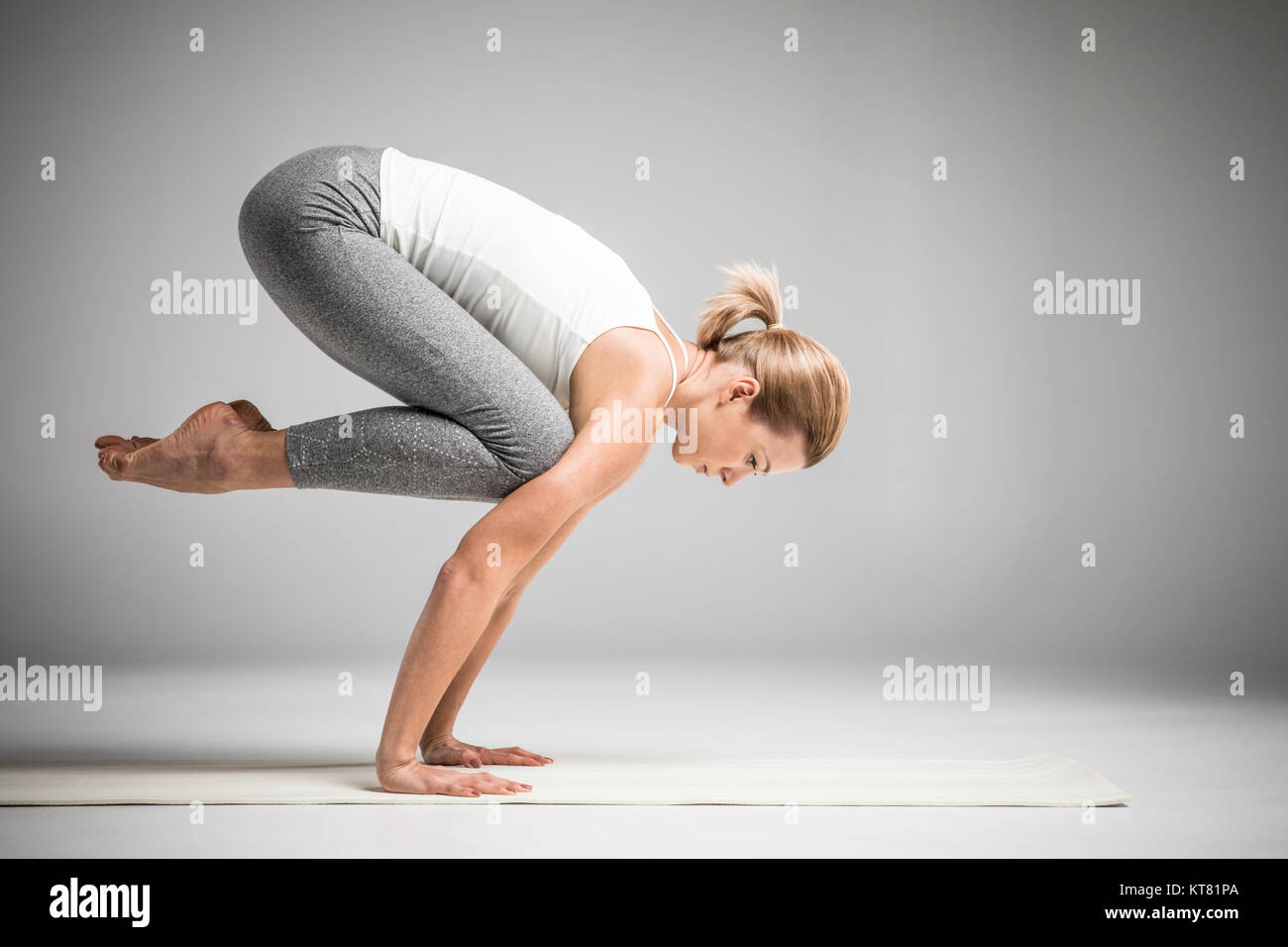 Woman standing in yoga position Stock Photo - Alamy