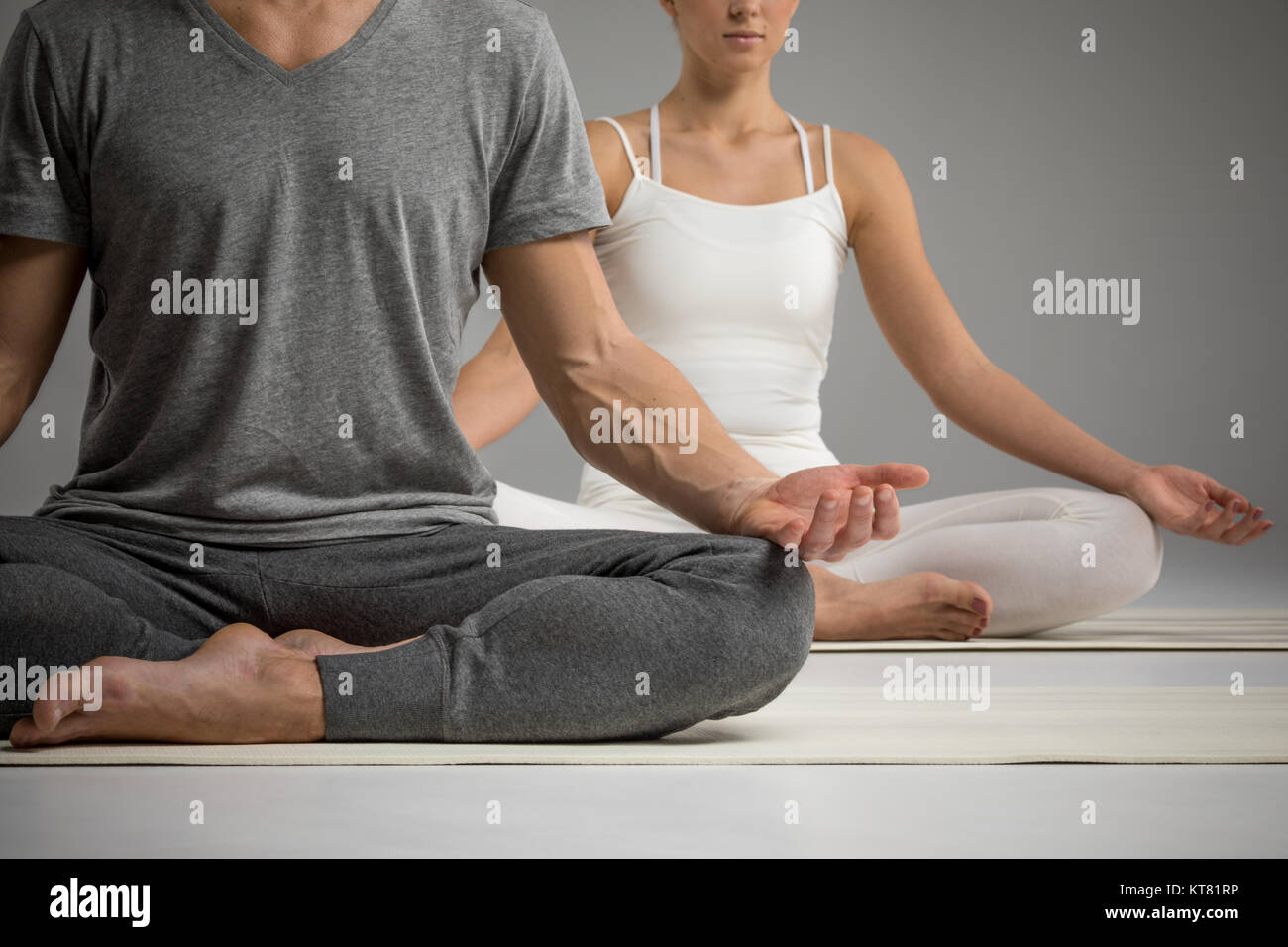 Couple Sitting In Lotus Position Stock Photos & Couple Sitting In Lotus ...