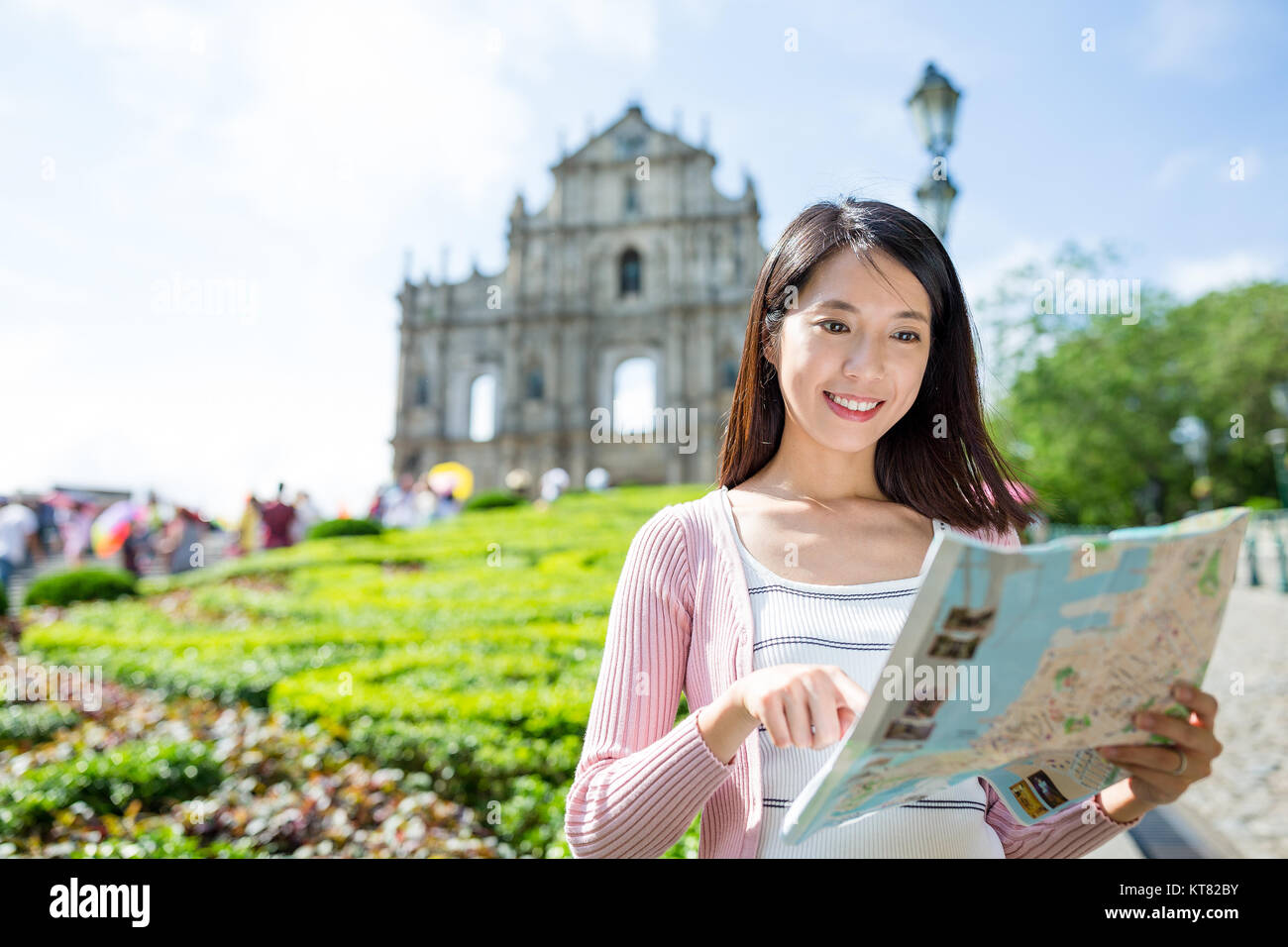 Woman searching the location in map Stock Photo - Alamy