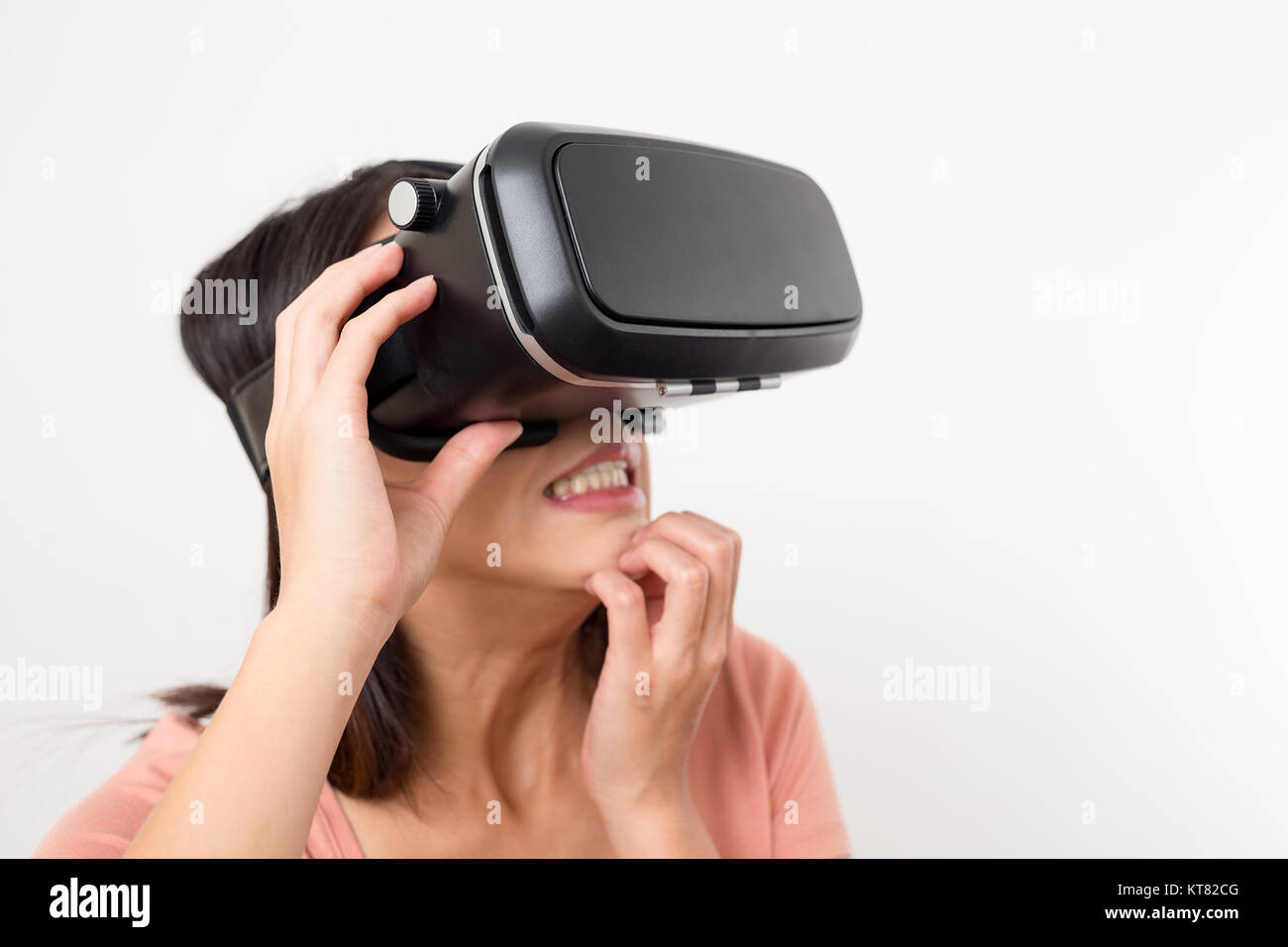 Woman using VR device Stock Photo - Alamy