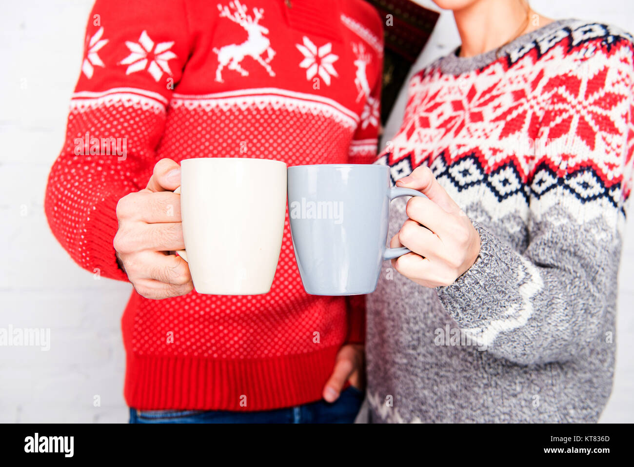 couple toasting with cups Stock Photo - Alamy