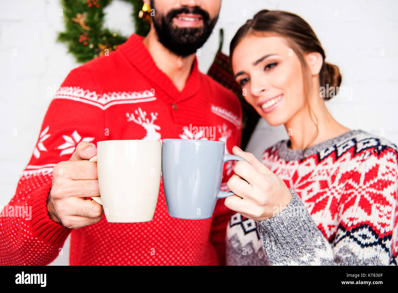 couple toasting with cups Stock Photo - Alamy
