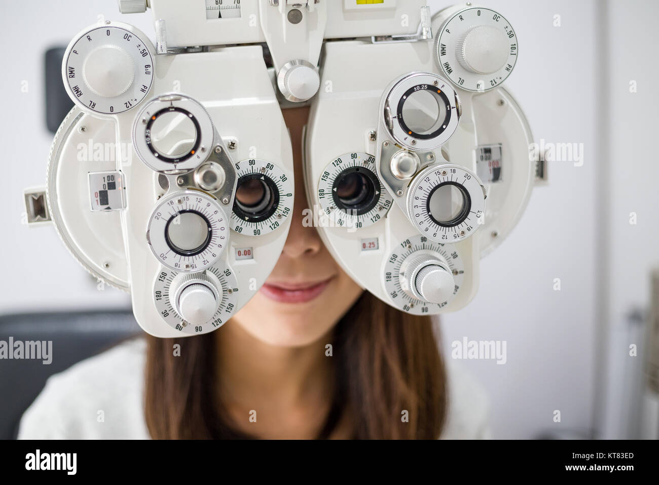 Young woman doing eye test Stock Photo - Alamy