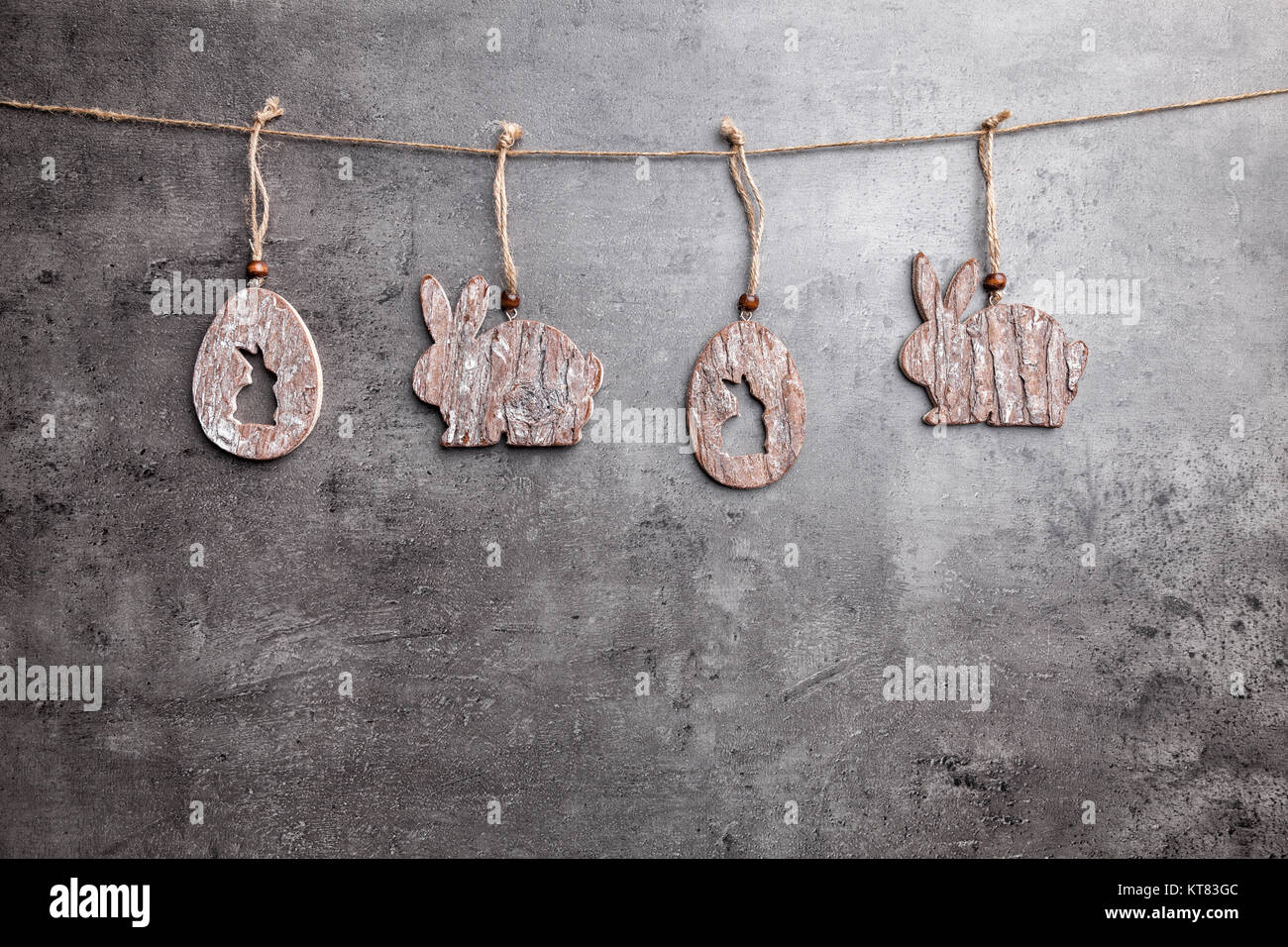 Easter decoration bunnies hanging on a string Stock Photo - Alamy