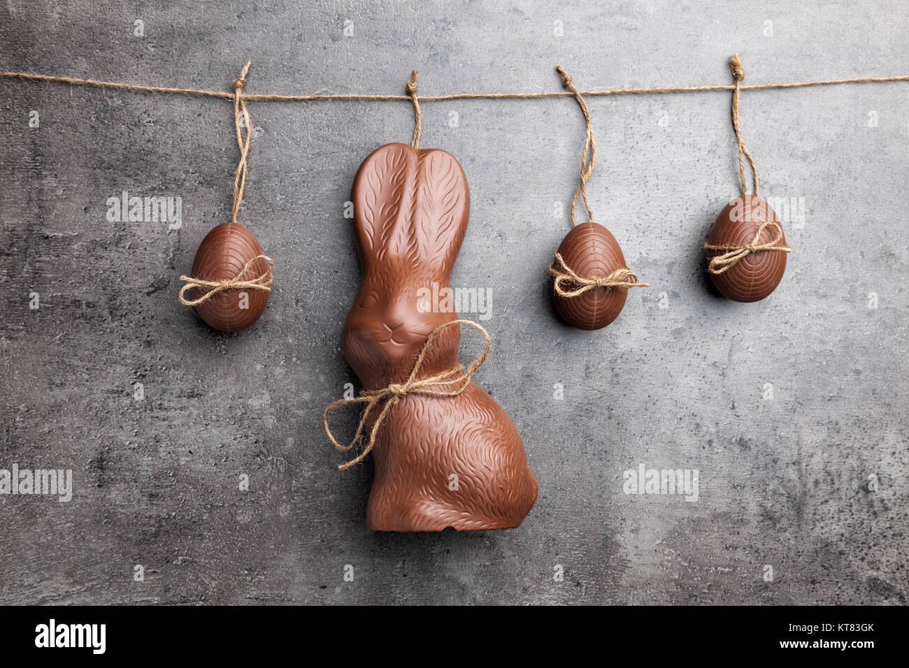 Delicious Easter chocolate bunny and eggs hanging on a string Stock ...