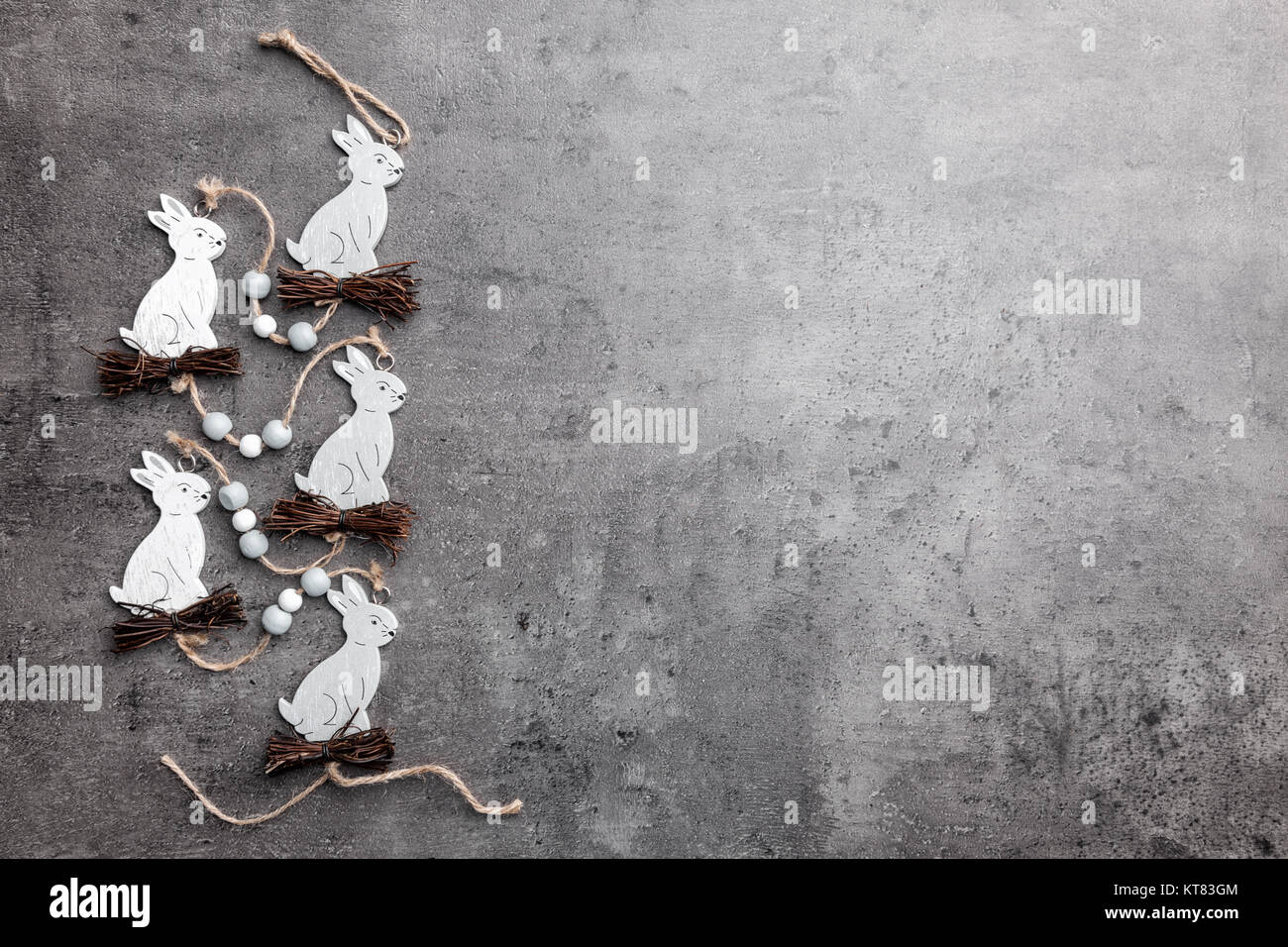 Easter bunnies on a grey rustic background Stock Photo - Alamy