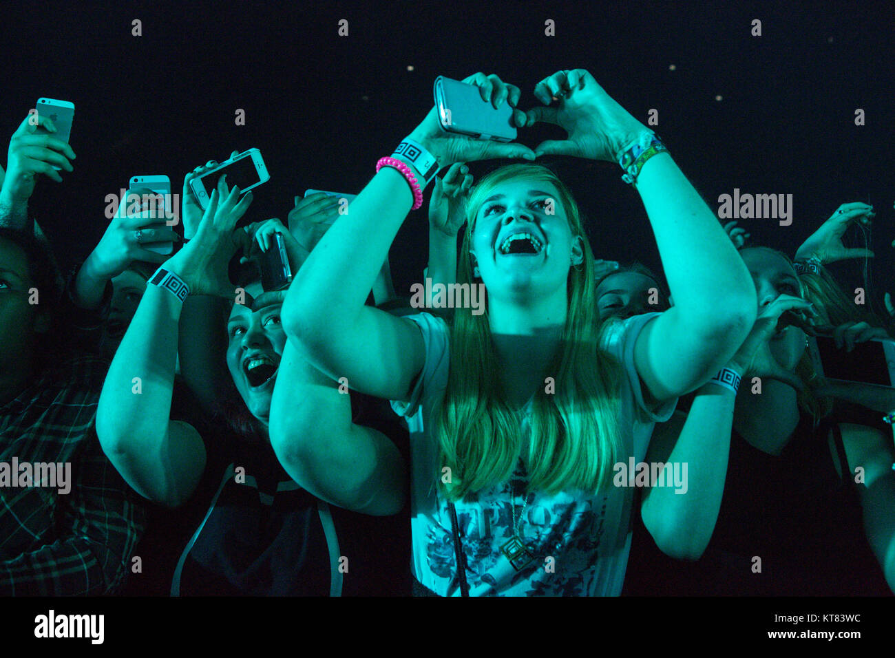 Female concert goers attend a concert with the English rock band The ...