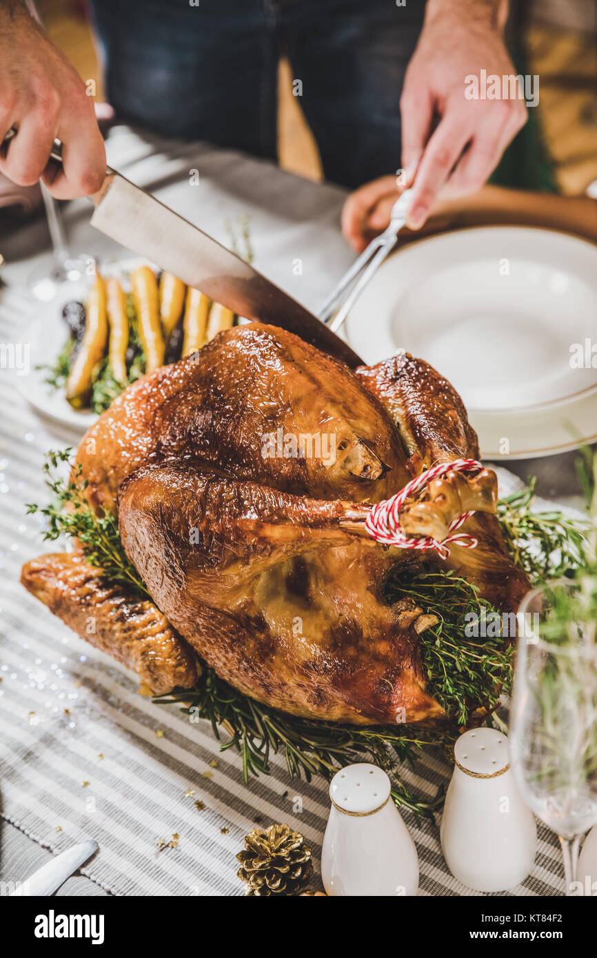 Man carving roasted turkey Stock Photo - Alamy