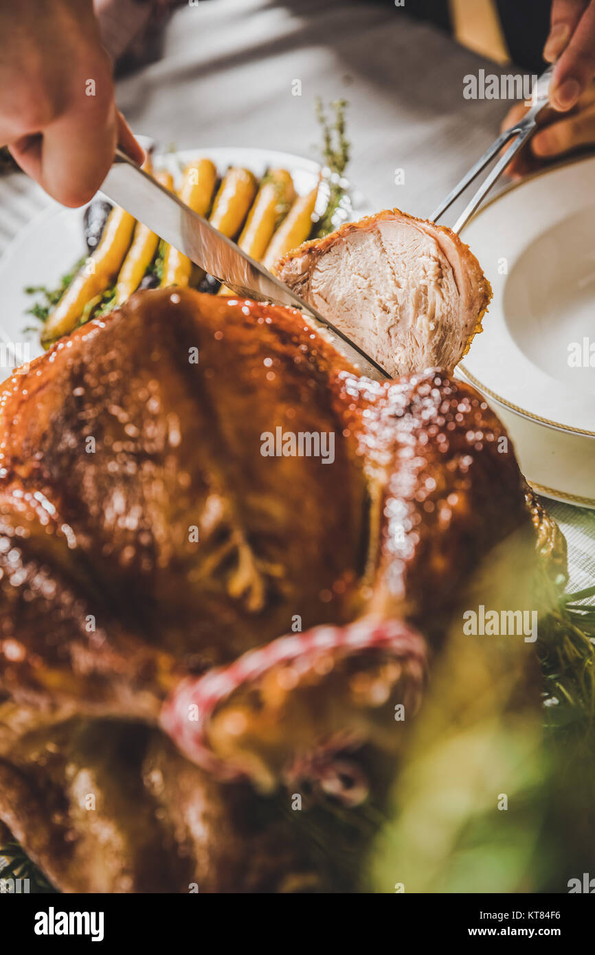 Man carving roasted turkey Stock Photo - Alamy