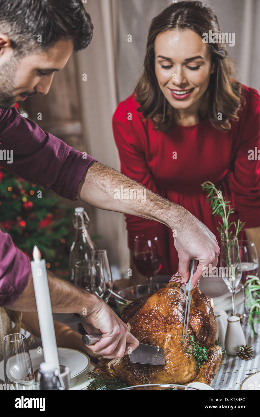 Man carving roasted turkey Stock Photo - Alamy