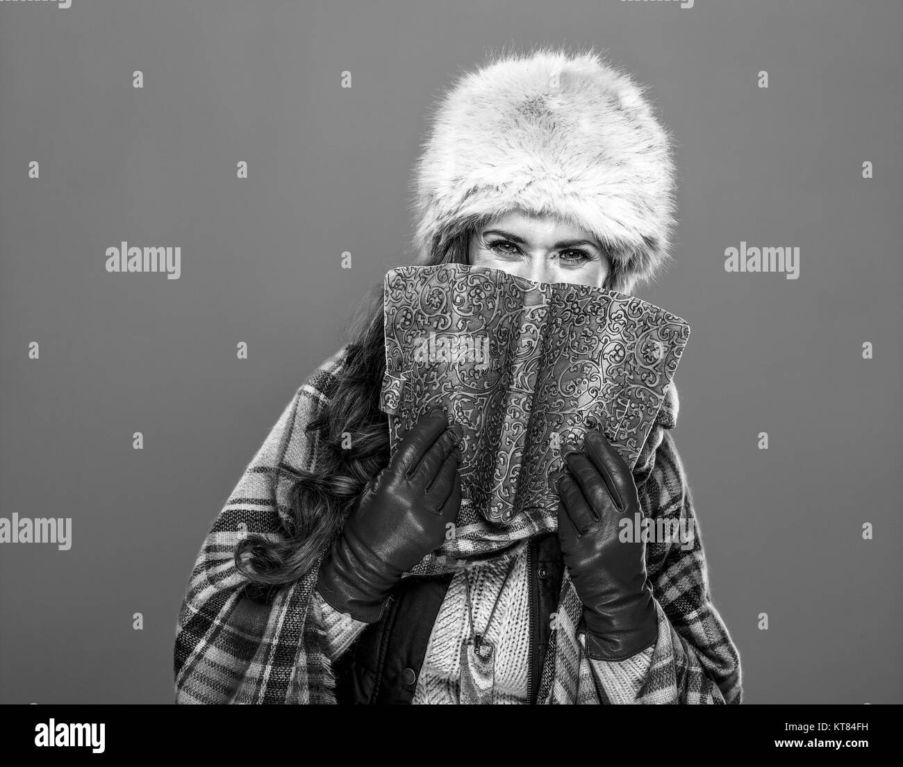 Woman hiding book holiday hi-res stock photography and images - Alamy
