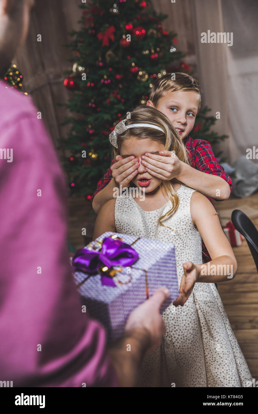 Girl receiving present Stock Photo - Alamy