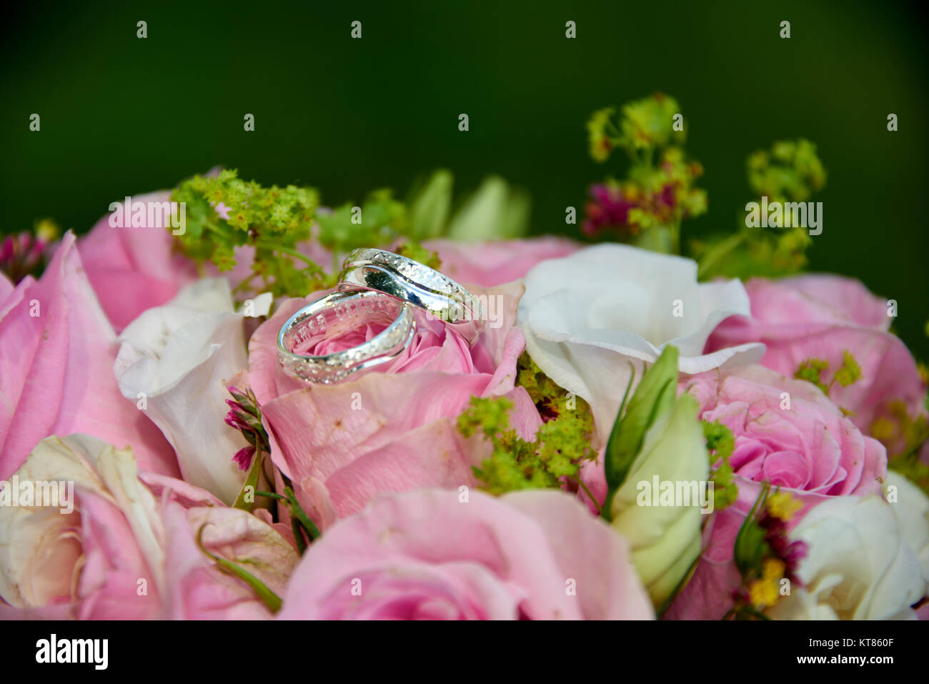 wedding bouquet with roses and rings Stock Photo - Alamy