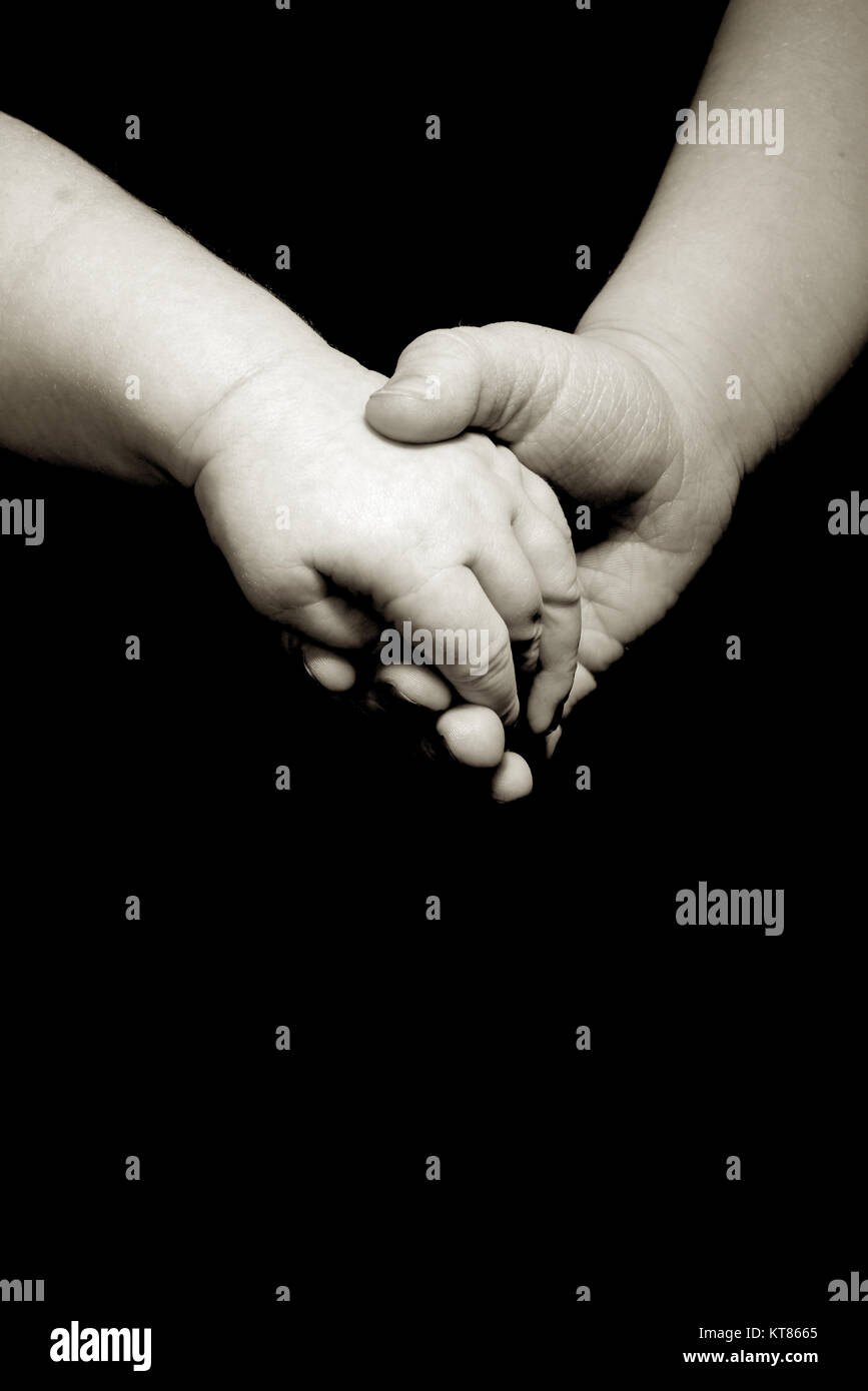 sister holding brothers hand Stock Photo - Alamy