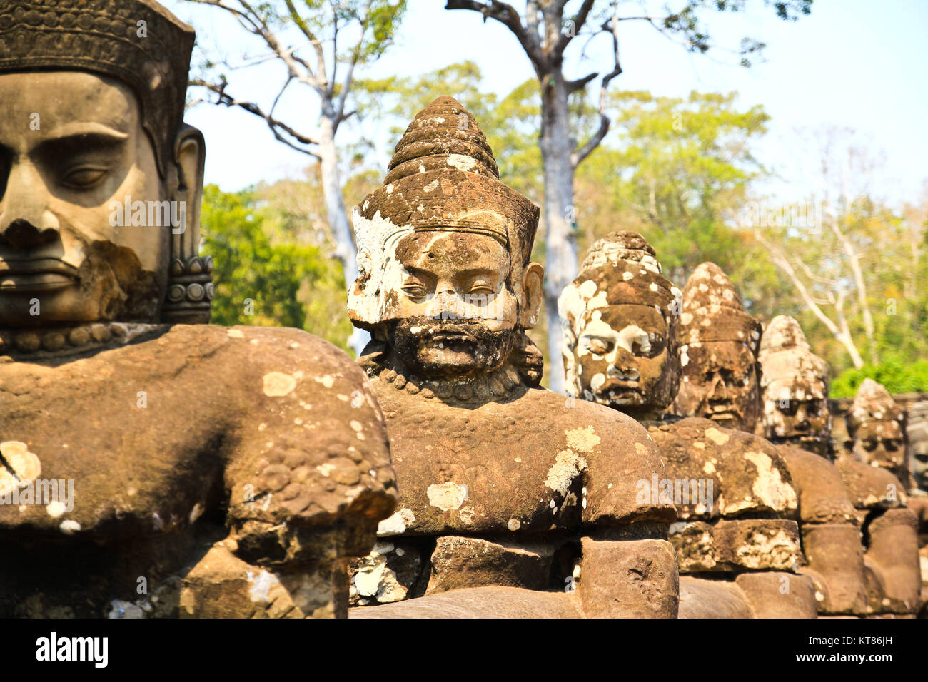 South gate to angkor thom in Cambodia is lined with warriors and demons ...