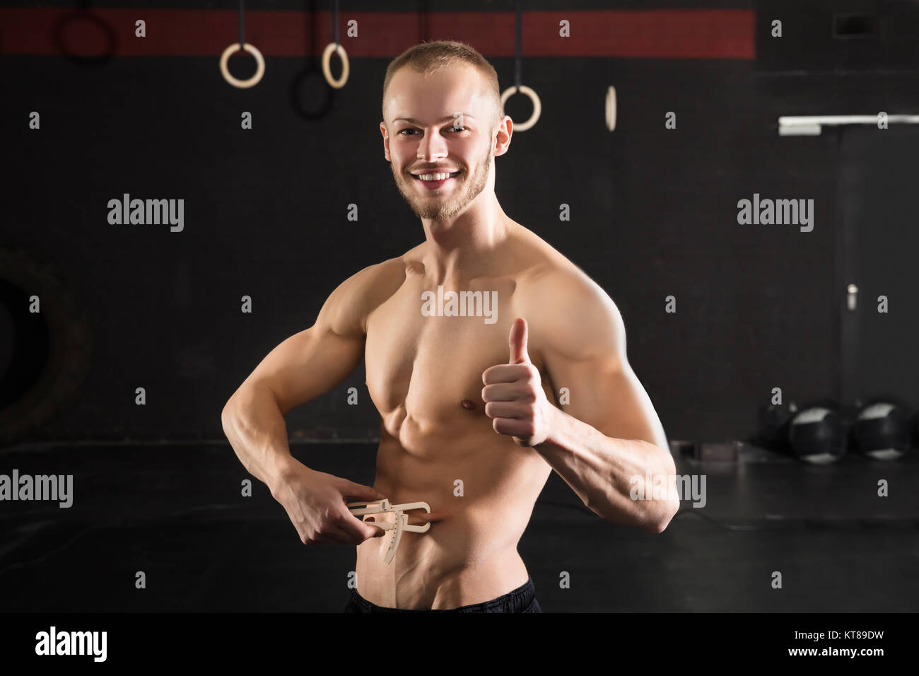 Person Measuring His Body Fat With Caliper Stock Photo - Alamy