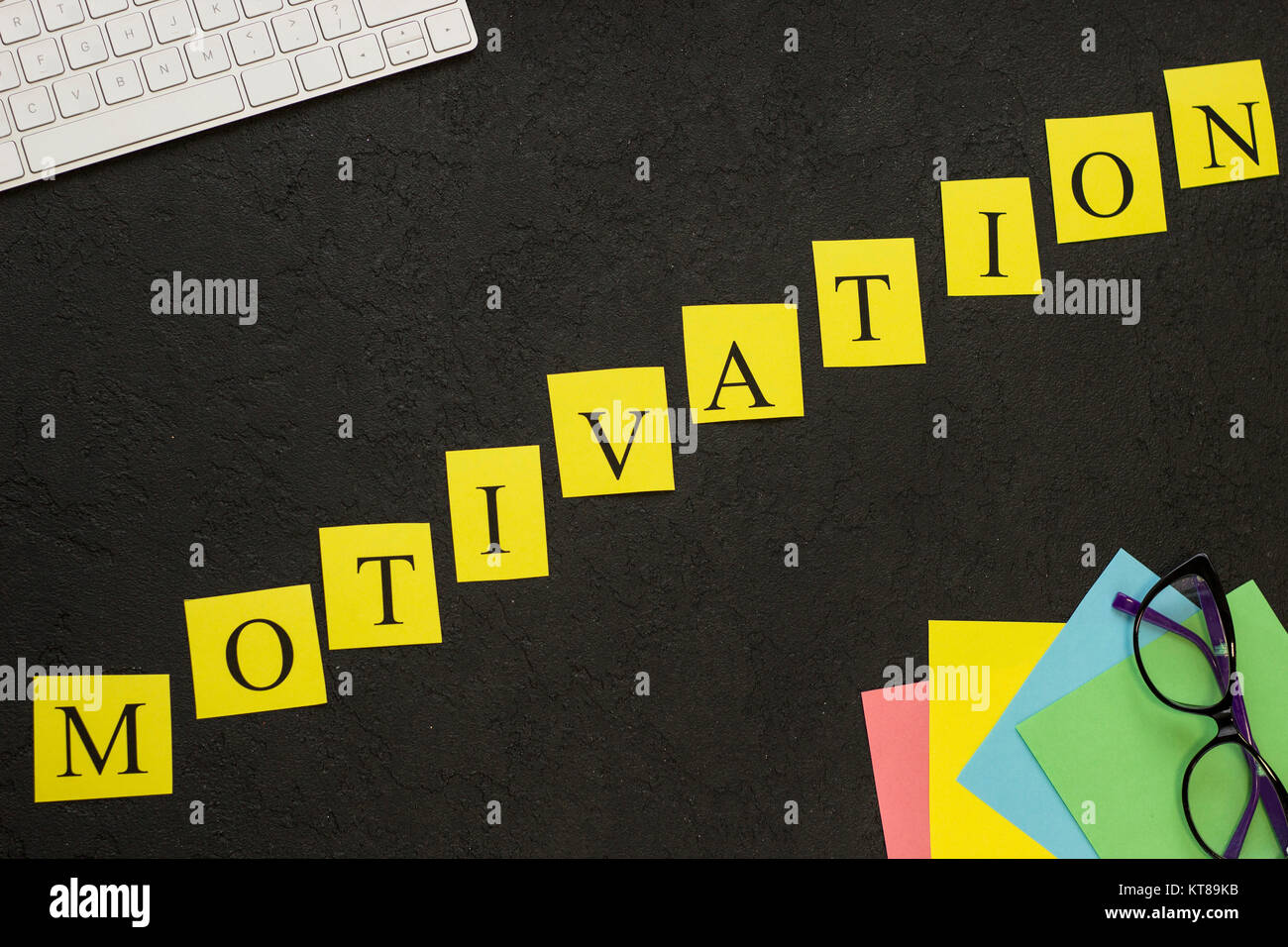Motivation diagonal inscription of letters printed on yellow papers ...