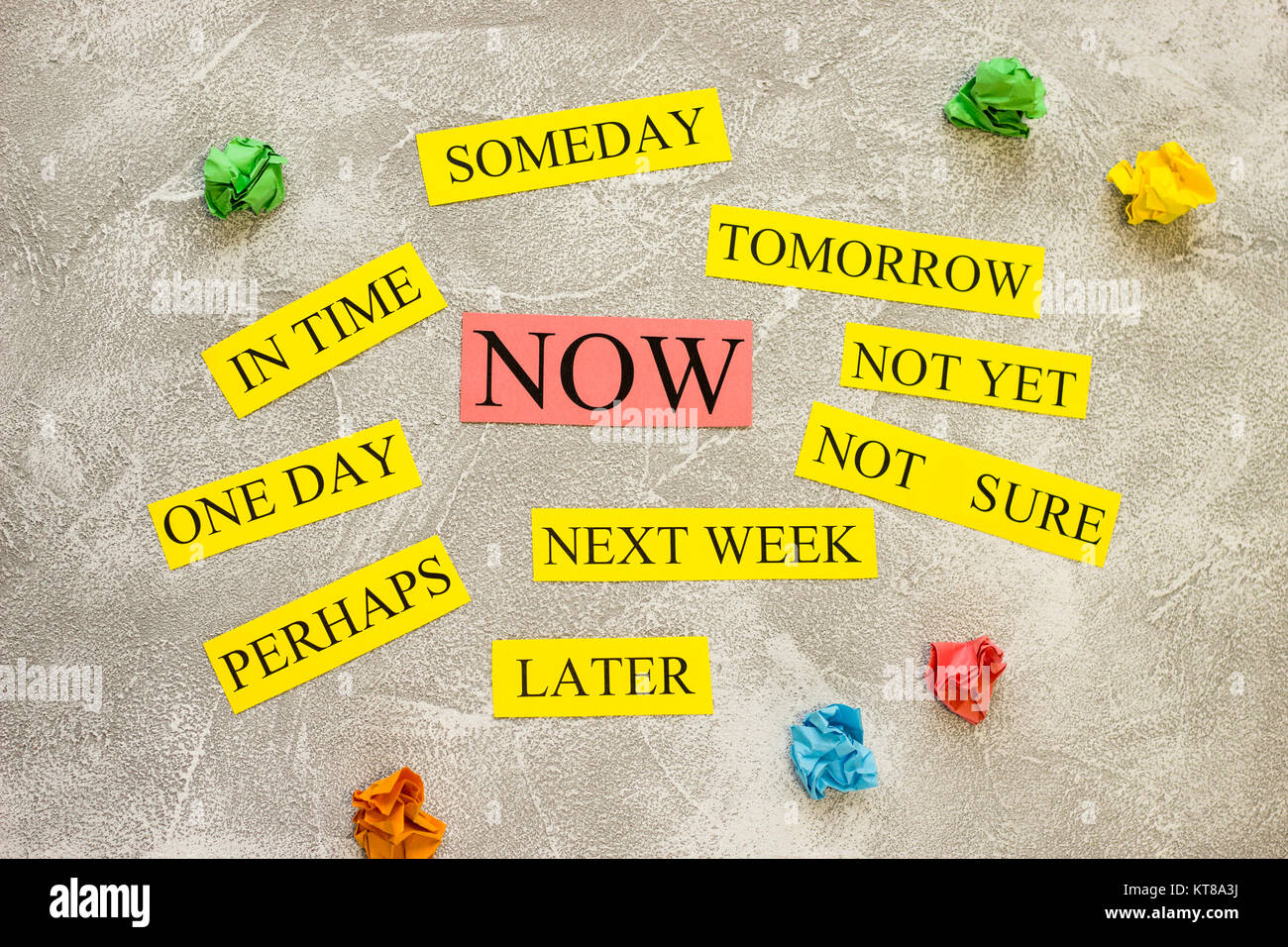 Do not delay work till tomorrow. Motivation words on a light concrete ...