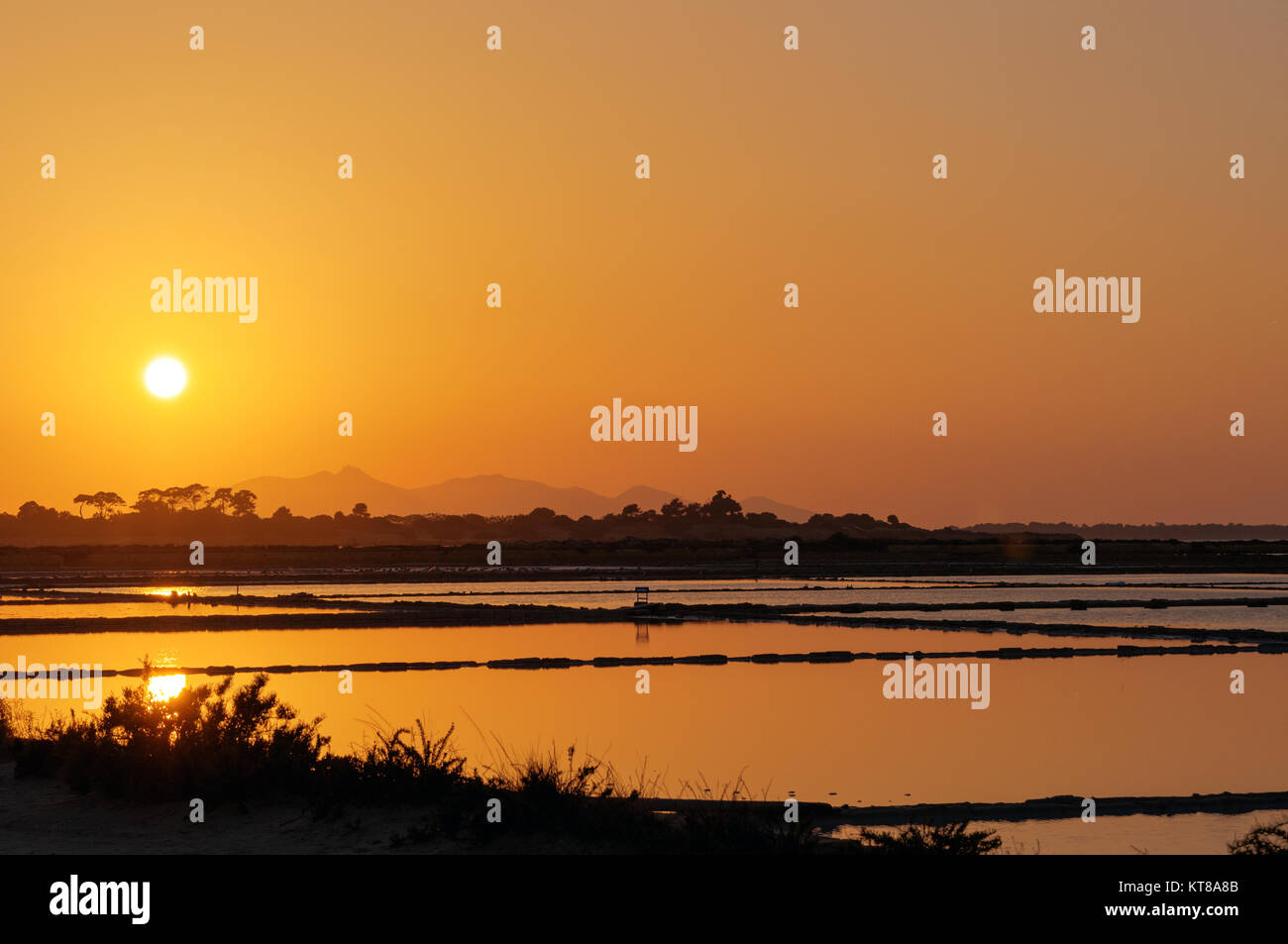 sunset at the salt pans of marsala in sicily Stock Photo - Alamy
