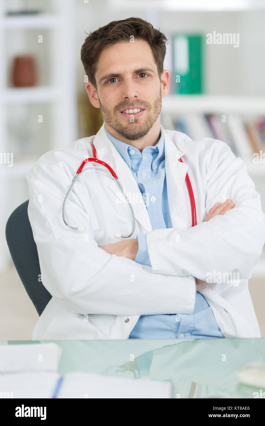 handsome young doctor at work in his office Stock Photo - Alamy