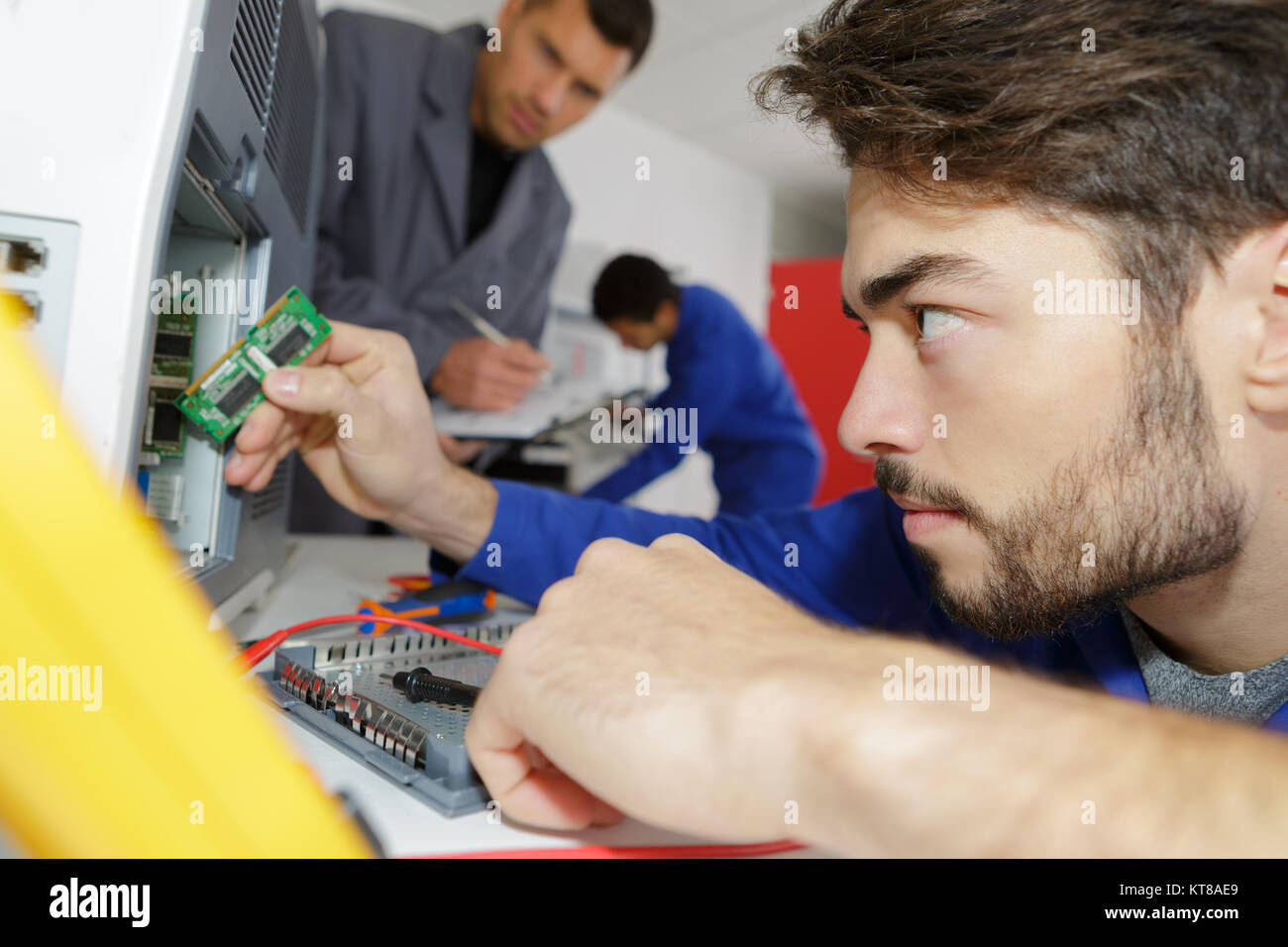 Male tech repairs electronic equipment hi-res stock photography and ...