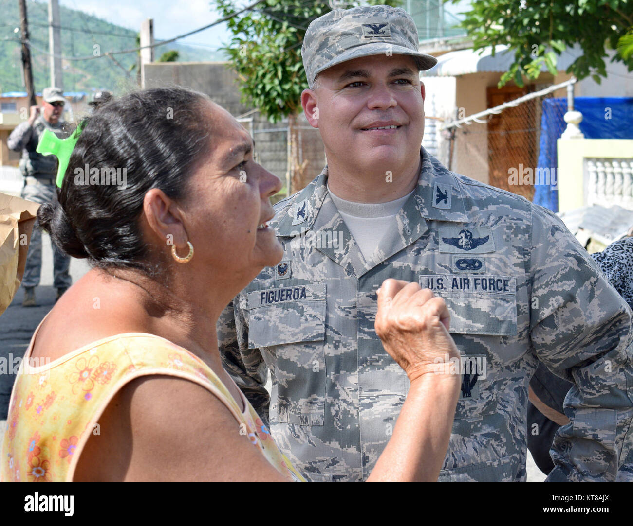 Col. Raymond Figueroa, commander of the 156th Airlift Wing, speaks with ...