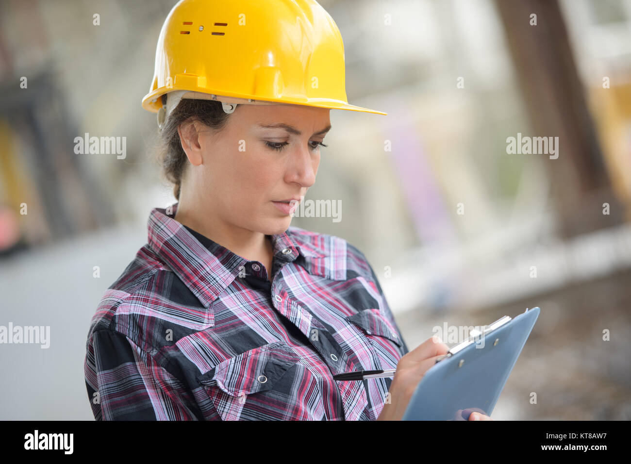 Woman engineer writing checklist hi-res stock photography and images ...